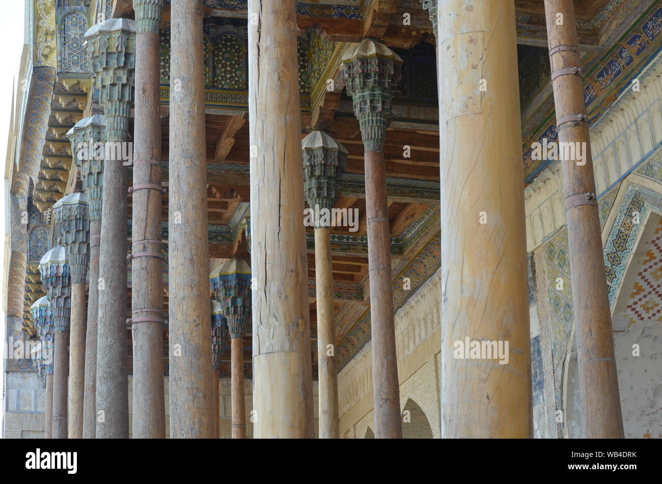 Ornated wooden columns and ceiling of Bolo Haouz Mosque in Bukhara ...