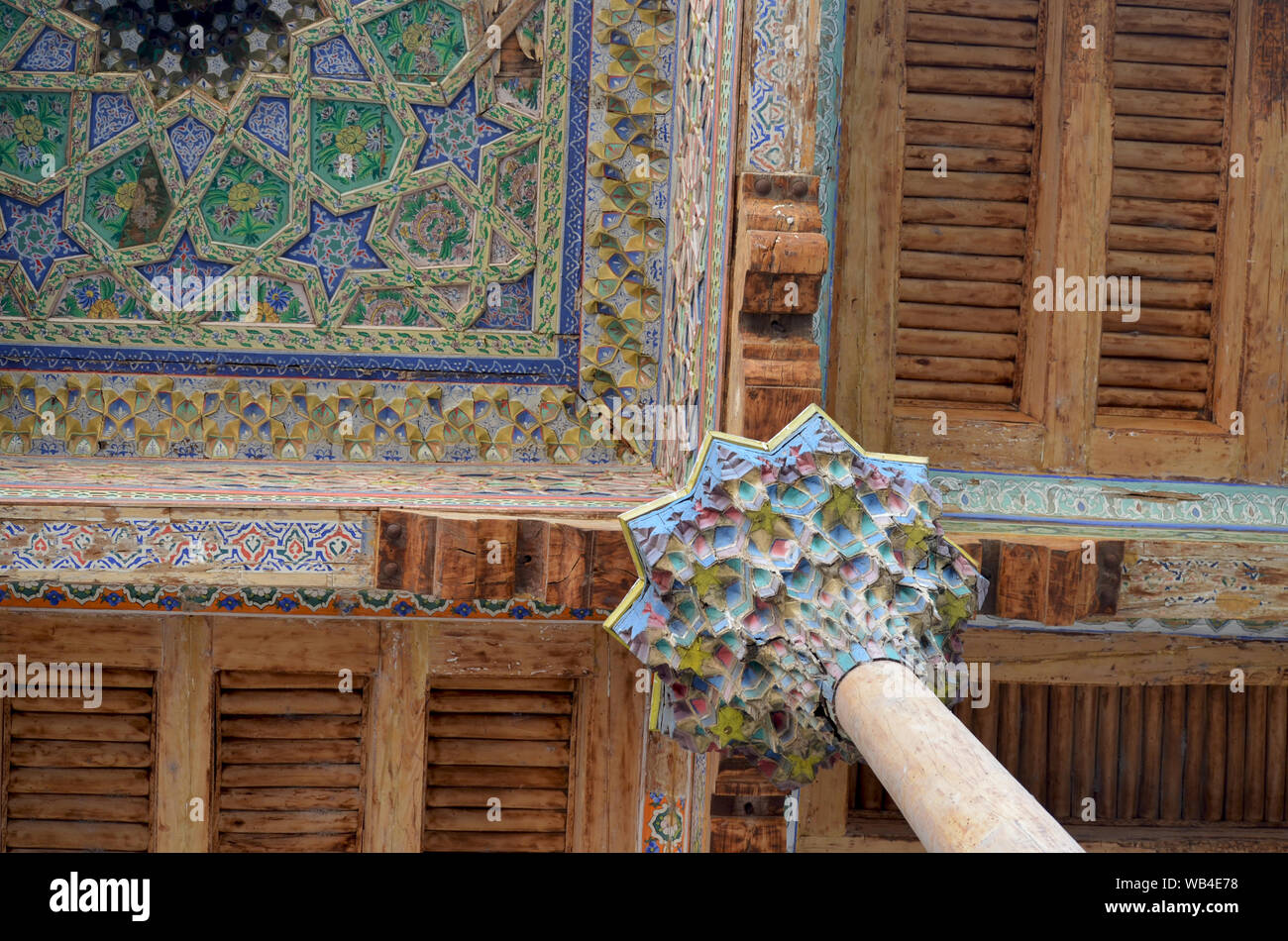 Ornated wooden columns and ceiling of Bolo Haouz Mosque in Bukhara ...