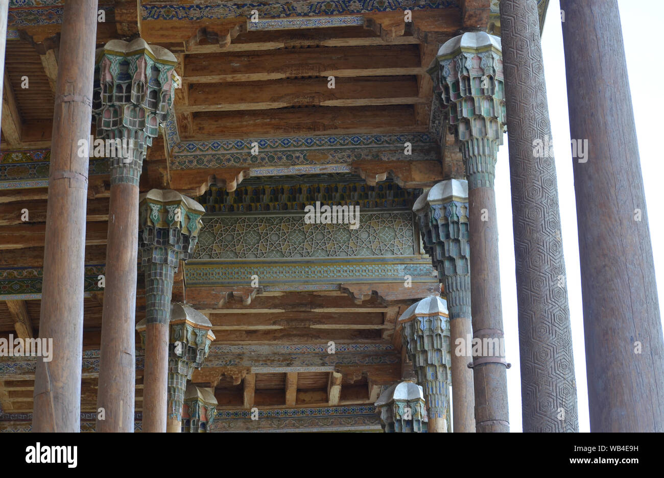 Ornated wooden columns and ceiling of Bolo Haouz Mosque in Bukhara ...