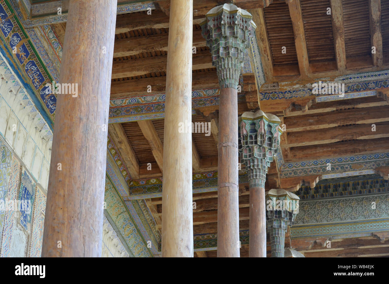 Ornated wooden columns and ceiling of Bolo Haouz Mosque in Bukhara ...
