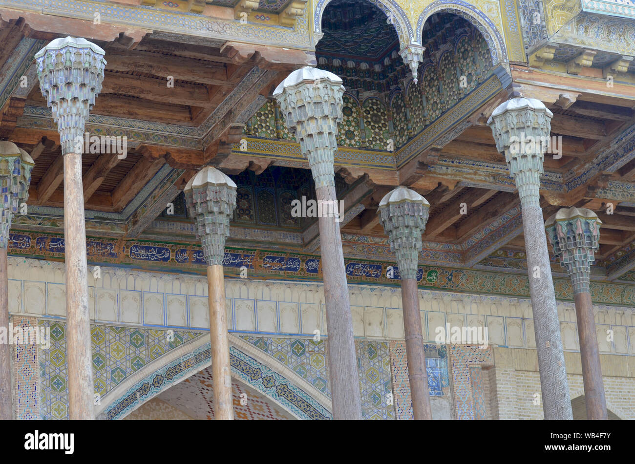 Ornated wooden columns and ceiling of Bolo Haouz Mosque in Bukhara ...