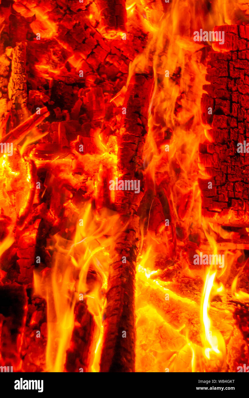background - flame over burning coals in the darkness Stock Photo - Alamy