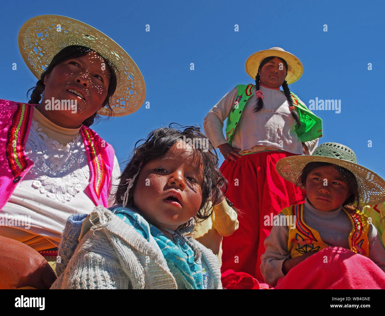 Uro women and children. The Uru or Uros are an indigenous people of ...