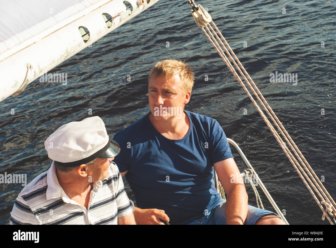 two men, young and older, aboard a sailing ship Stock Photo - Alamy