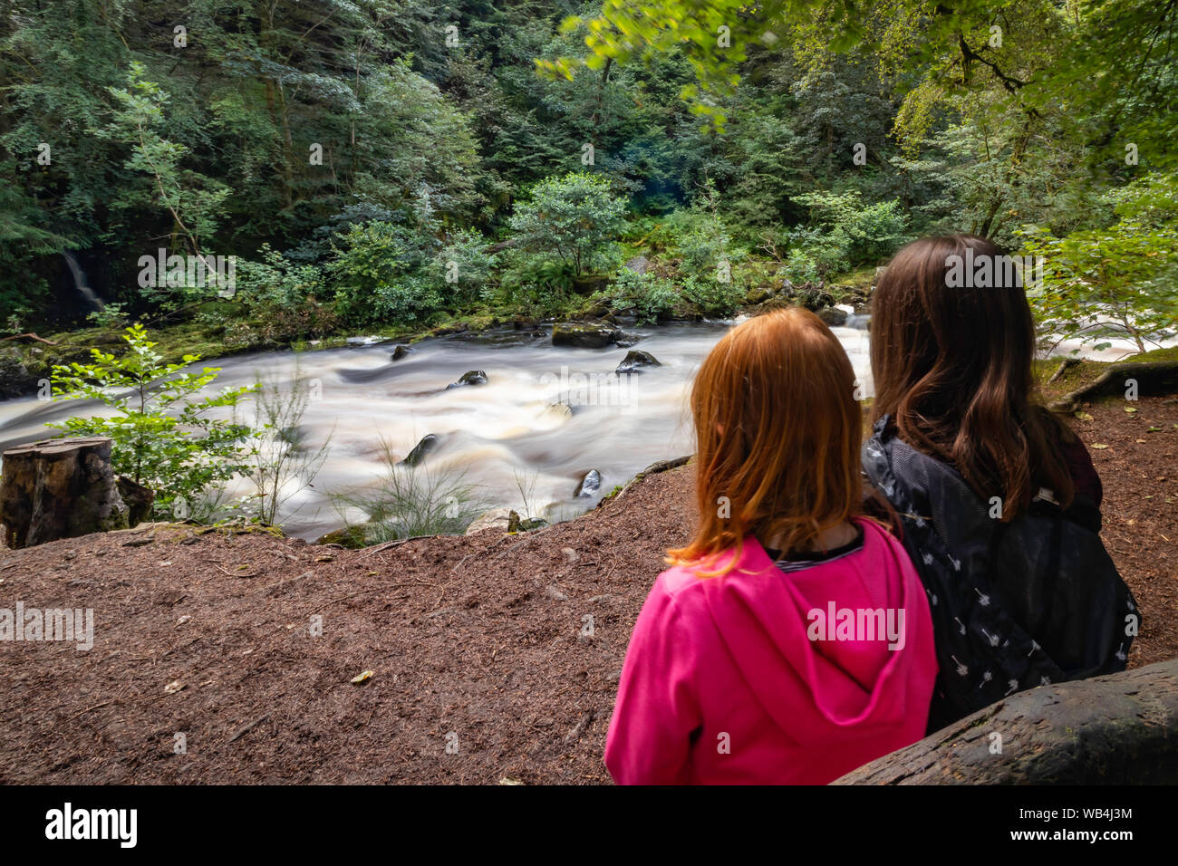Girls by a river Stock Photo - Alamy