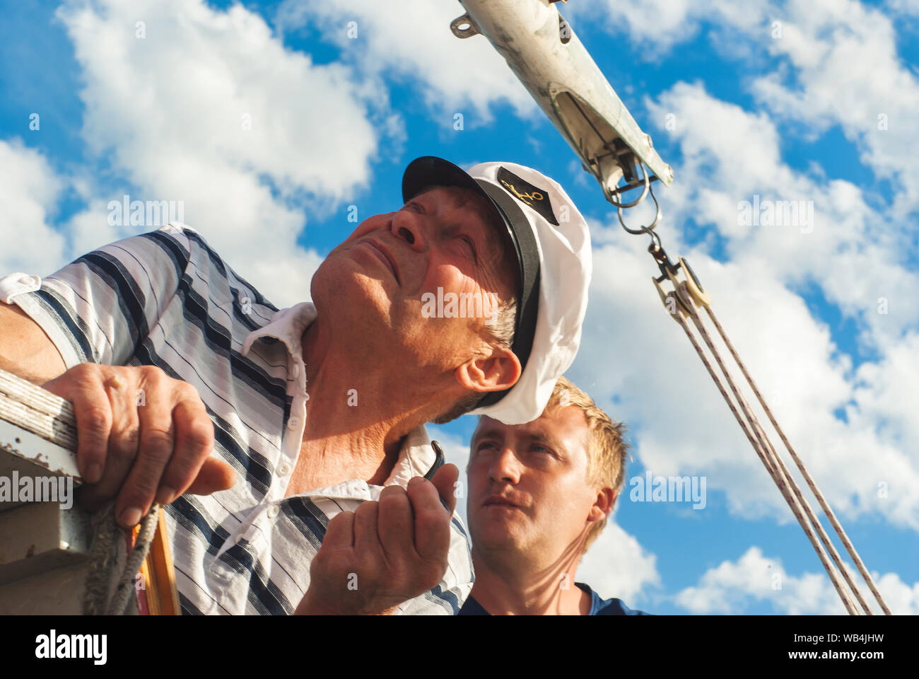 two men, young and older, aboard a sailing ship Stock Photo - Alamy