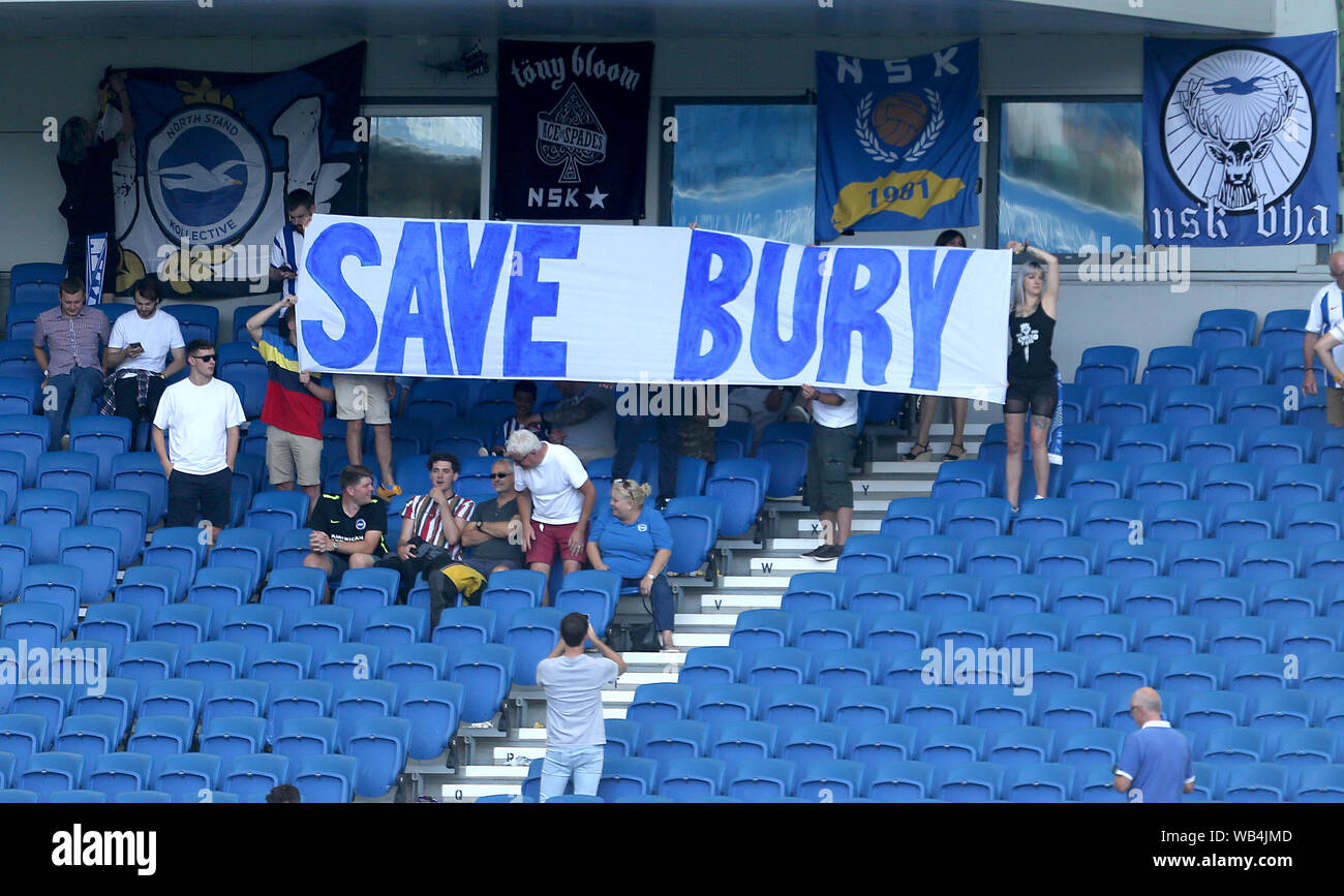 Brighton & Hove Albion fans with a 'Save Bury' banner in the stands ...