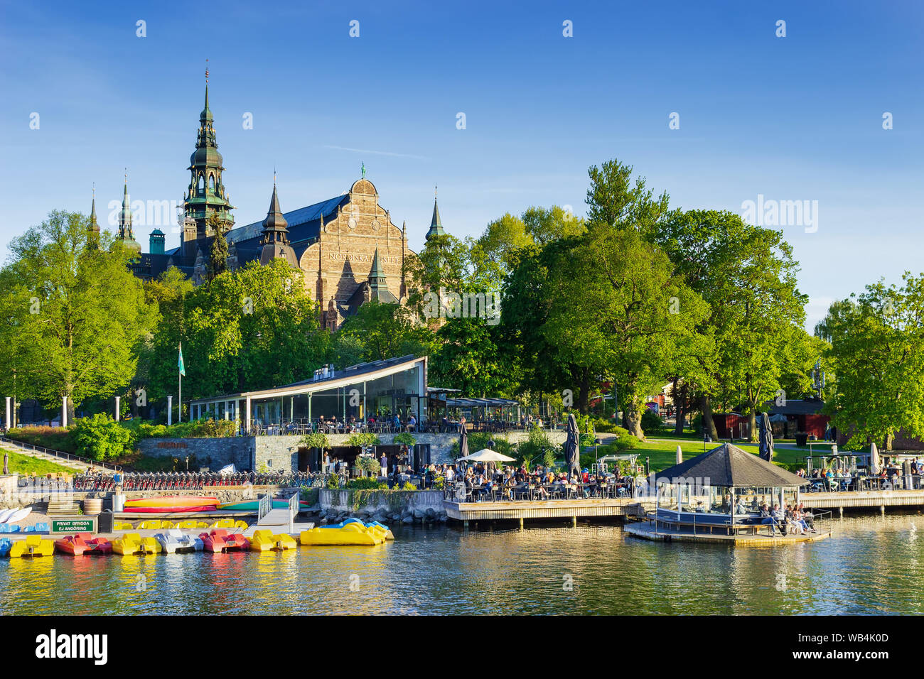 Crowded floating dock-restaurants and coffee shops with sports rental ...