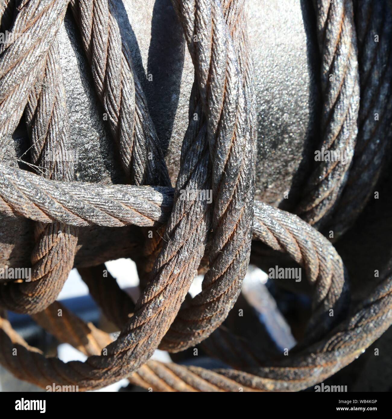 A close up of fishing rope wrapped around a spool Stock Photo - Alamy