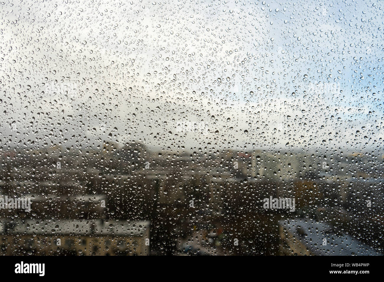 Raindrops on the window. Landscape through the humid glass. Metaphor of ...