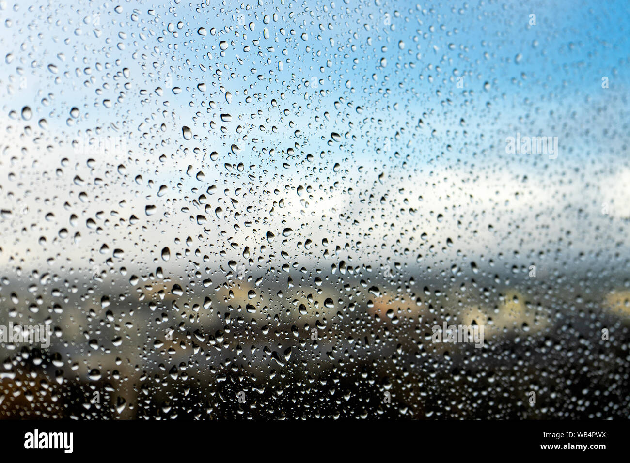 Raindrops on the window. Landscape through the humid glass. Metaphor of ...