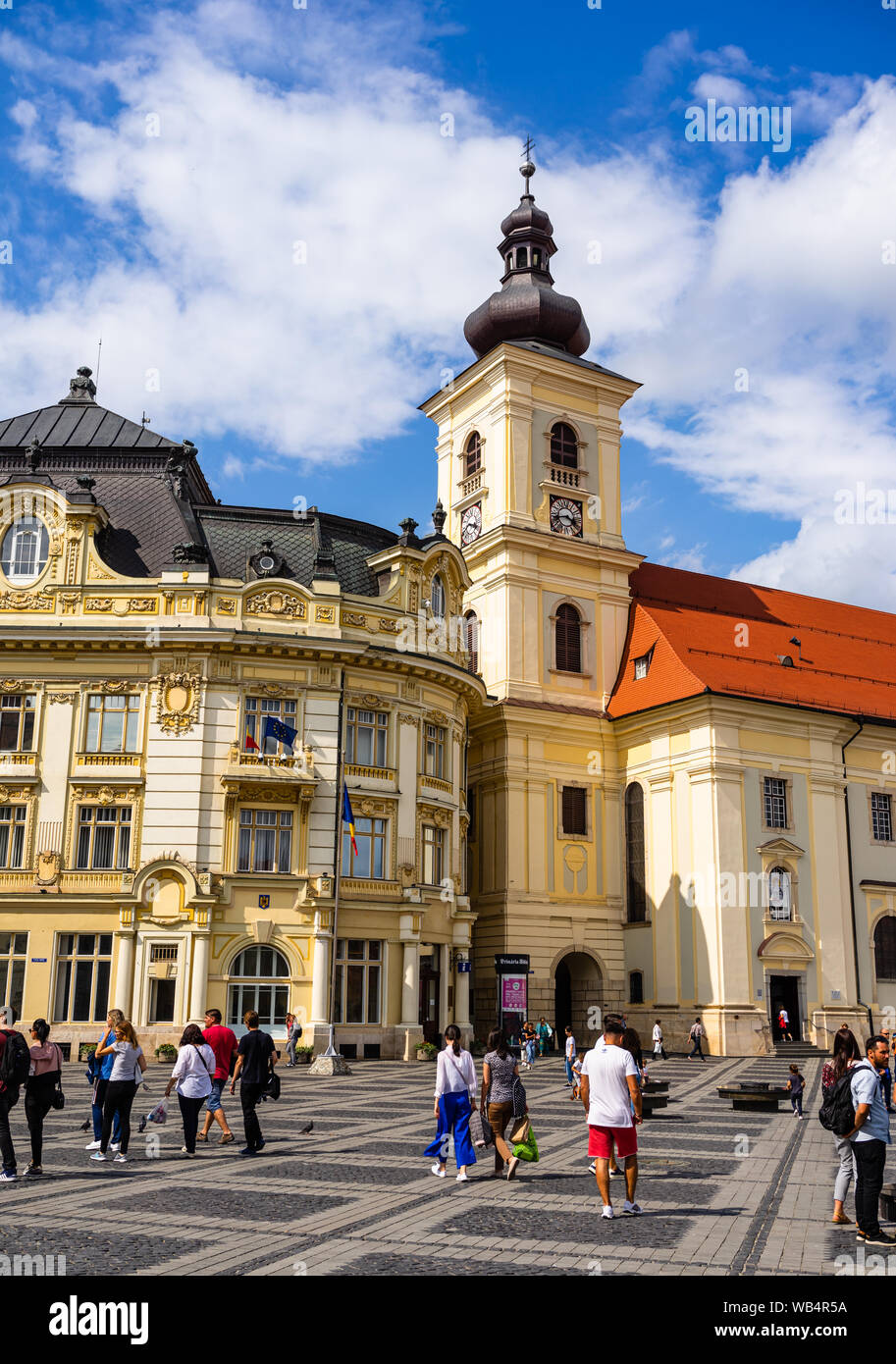 Sibiu, Romania - 2019. Tourists wandering in The Big Square of Sibiu ...