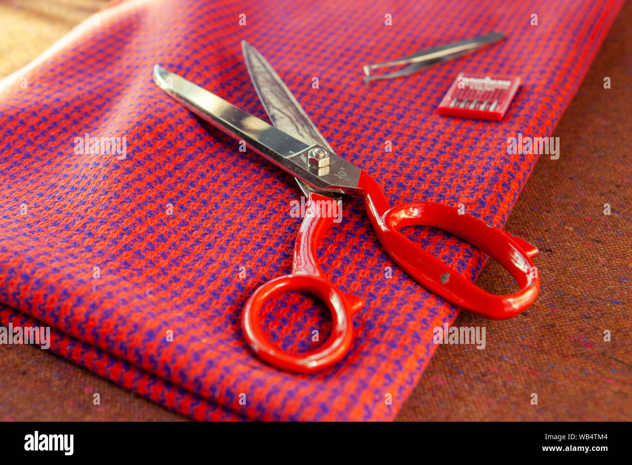 Sewing equipment composition on the table: scissors, fabric. Fashion ...