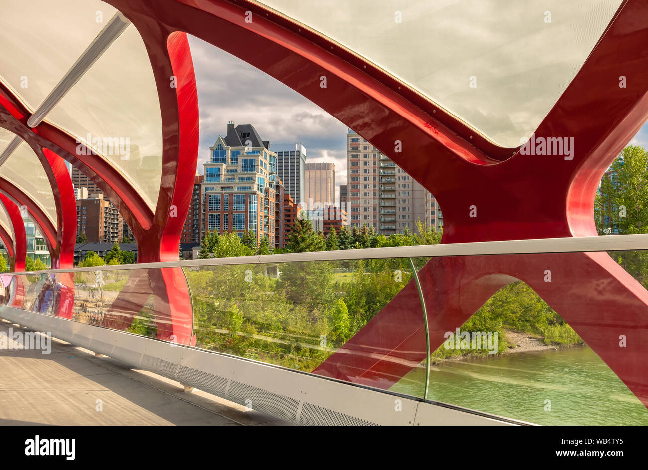 Calgary downtown seen through the structure of the Peace Bridge at ...