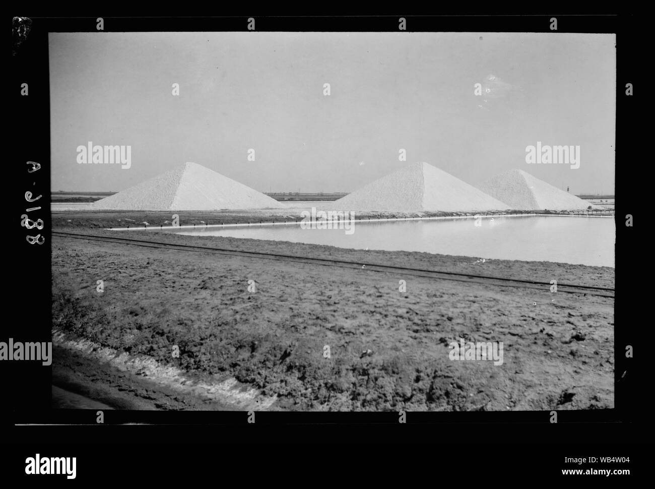 Egypt. Port Said. So. east salt works. Piles of salt in pyramid form ...