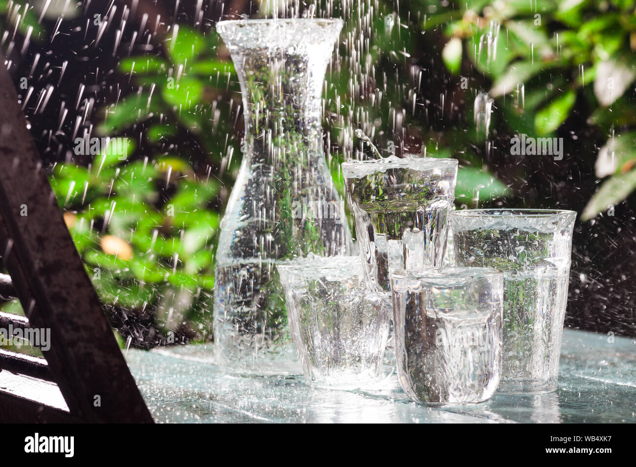 Glasses full of water for the refreshment on a hot summer day. Rain ...