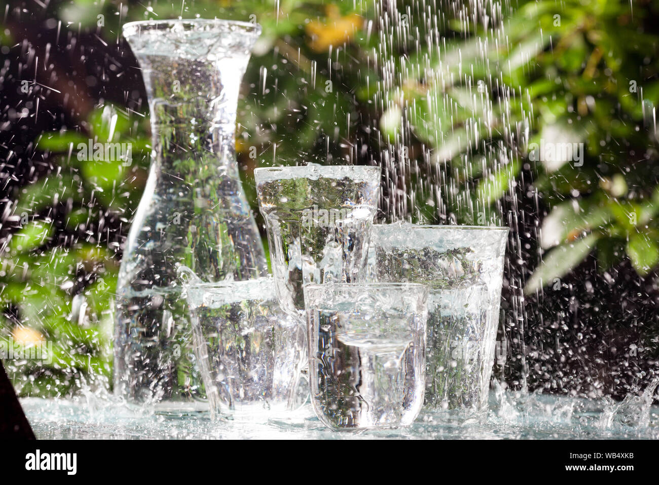 Glasses full of water for the refreshment on a hot summer day. Rain ...