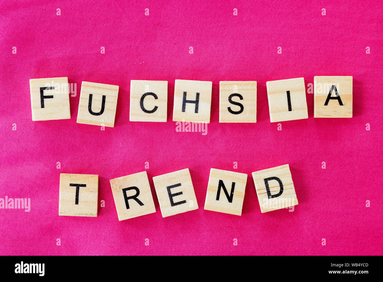the words fuchsia trend is written in cubic letters on a bright pink ...
