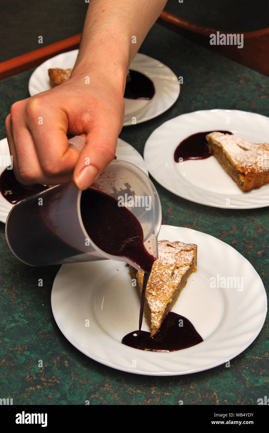 cooks adding sauce to delicious homemade apple pies Stock Photo - Alamy