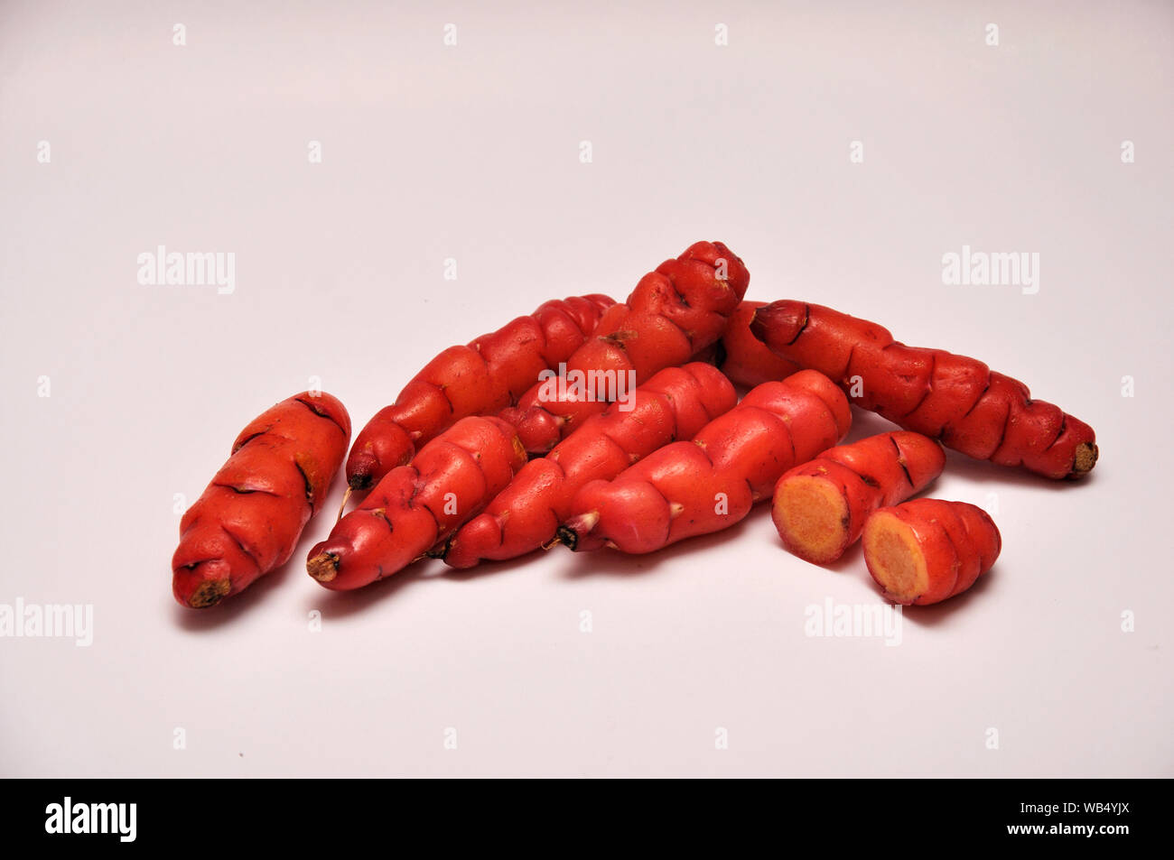 whole and sliced red yams on a seamless background Stock Photo - Alamy