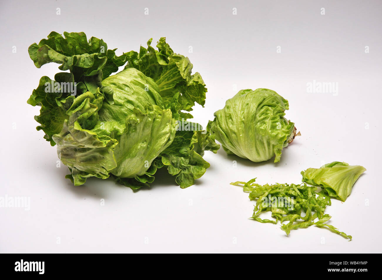 whole and sliced lettuce on a seamless background Stock Photo - Alamy