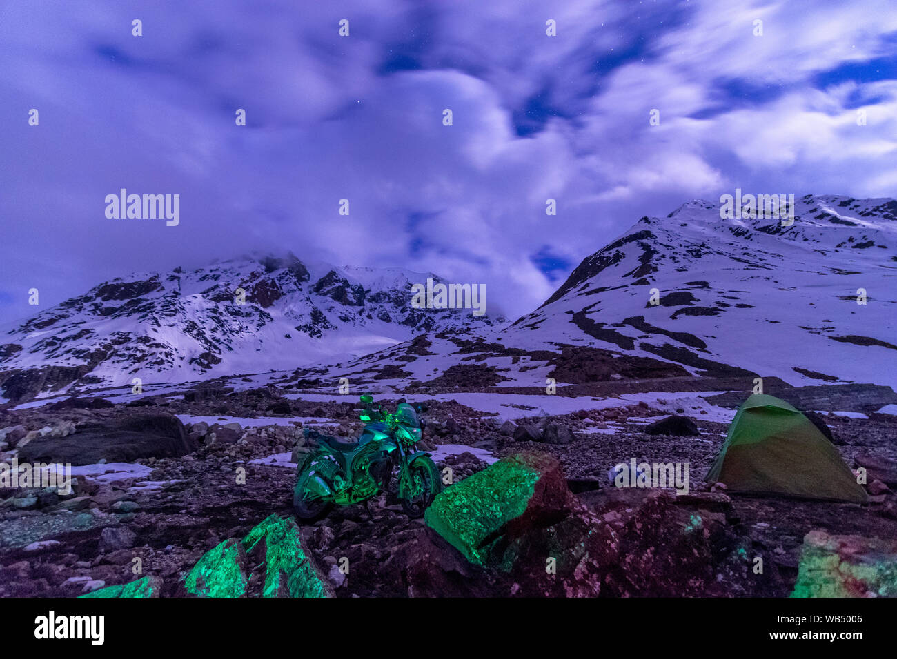 Motorcycle Camping Under Cloudy Starry Night in Ladakh Stock Photo - Alamy