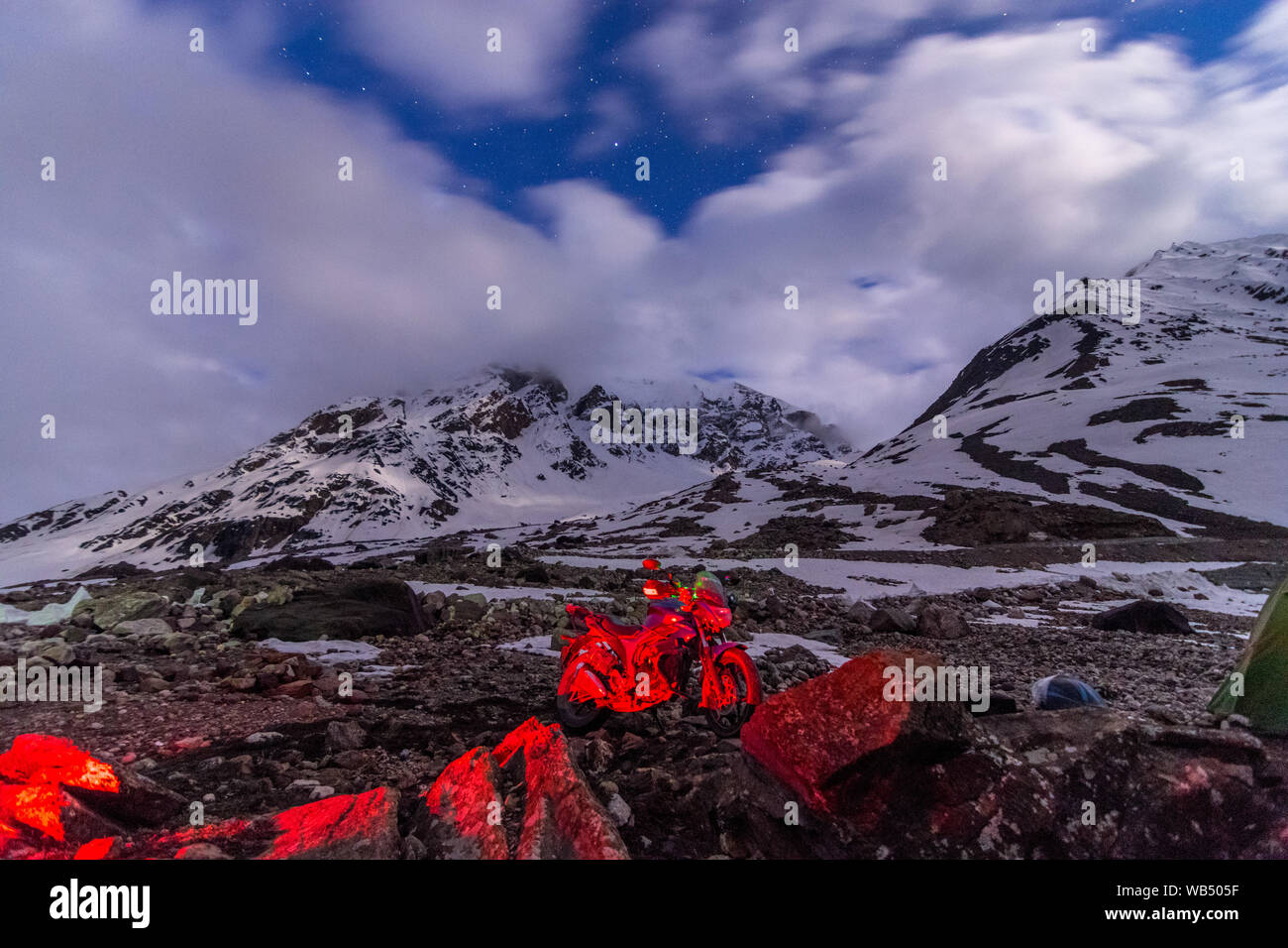 Motorcycle Camping Under Cloudy Starry Night in Ladakh Stock Photo - Alamy