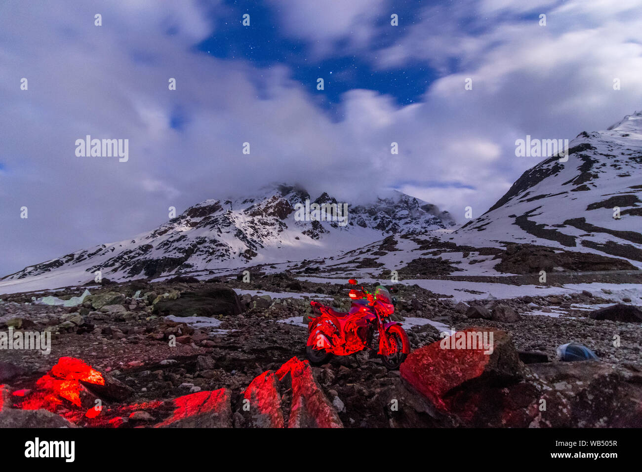 Motorcycle Camping Under Cloudy Starry Night in Ladakh Stock Photo - Alamy