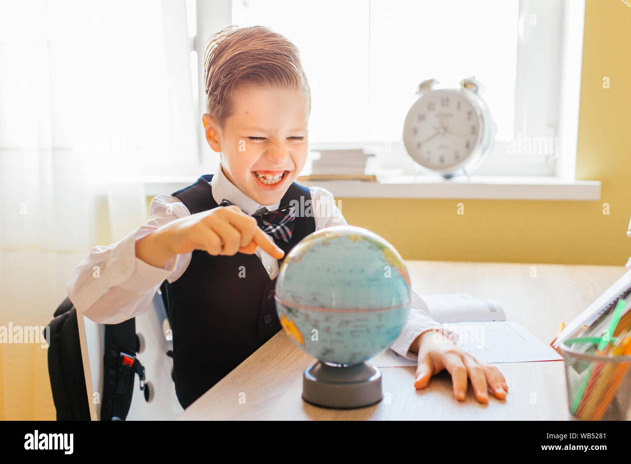 Education at home concept - Cute little boy studying or completing home ...