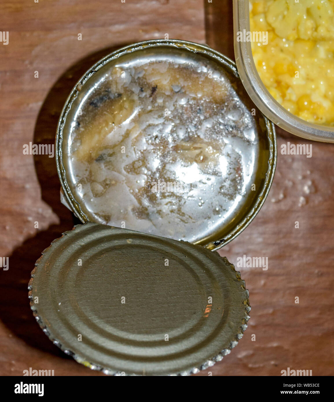 Open canned fish. Cheap canned a fish Stock Photo - Alamy