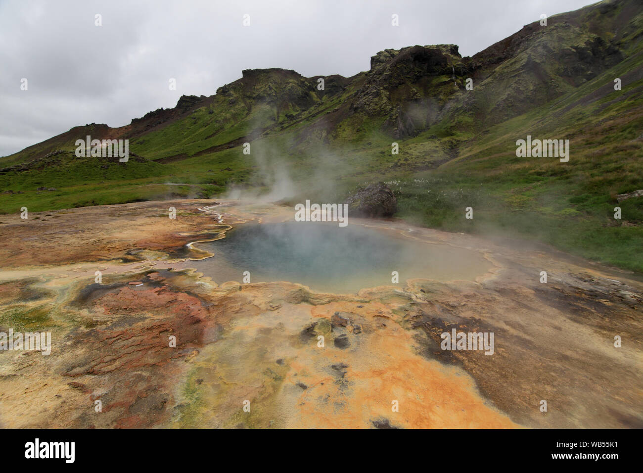 A colourful sulphuric hot spring in the remote Icelandic landscape ...