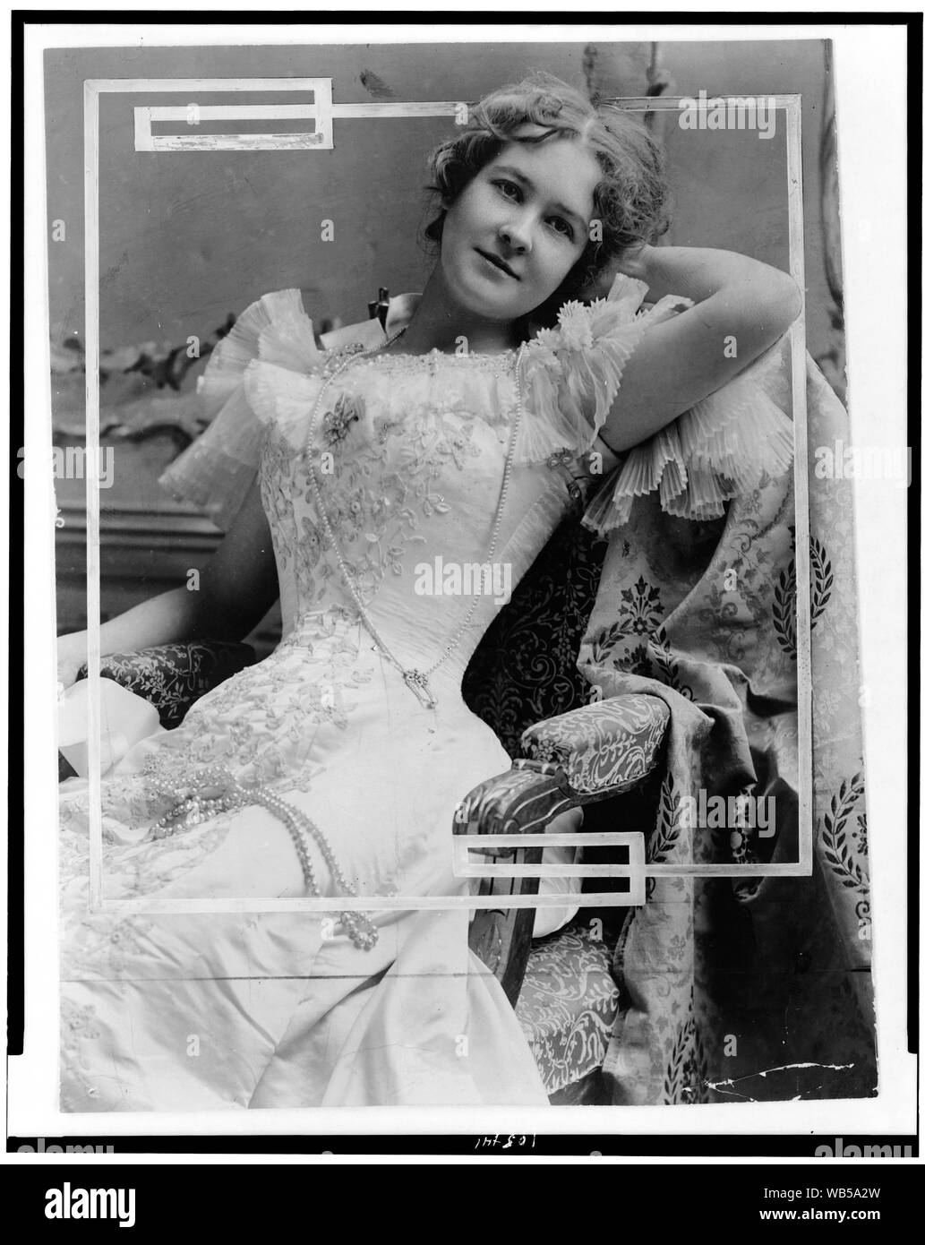 Emilie Grigsby, three-quarter length portrait, seated, facing slightly ...