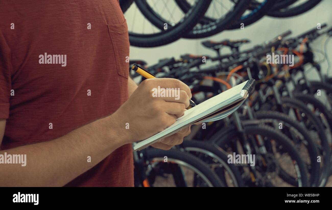 theme of small business selling bicycles. Young Caucasian male brunette ...