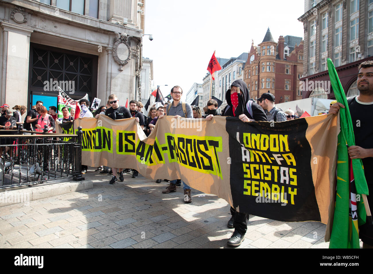 London, UK. 24th August 2019. Participants of Antifa, an anti-fascist ...