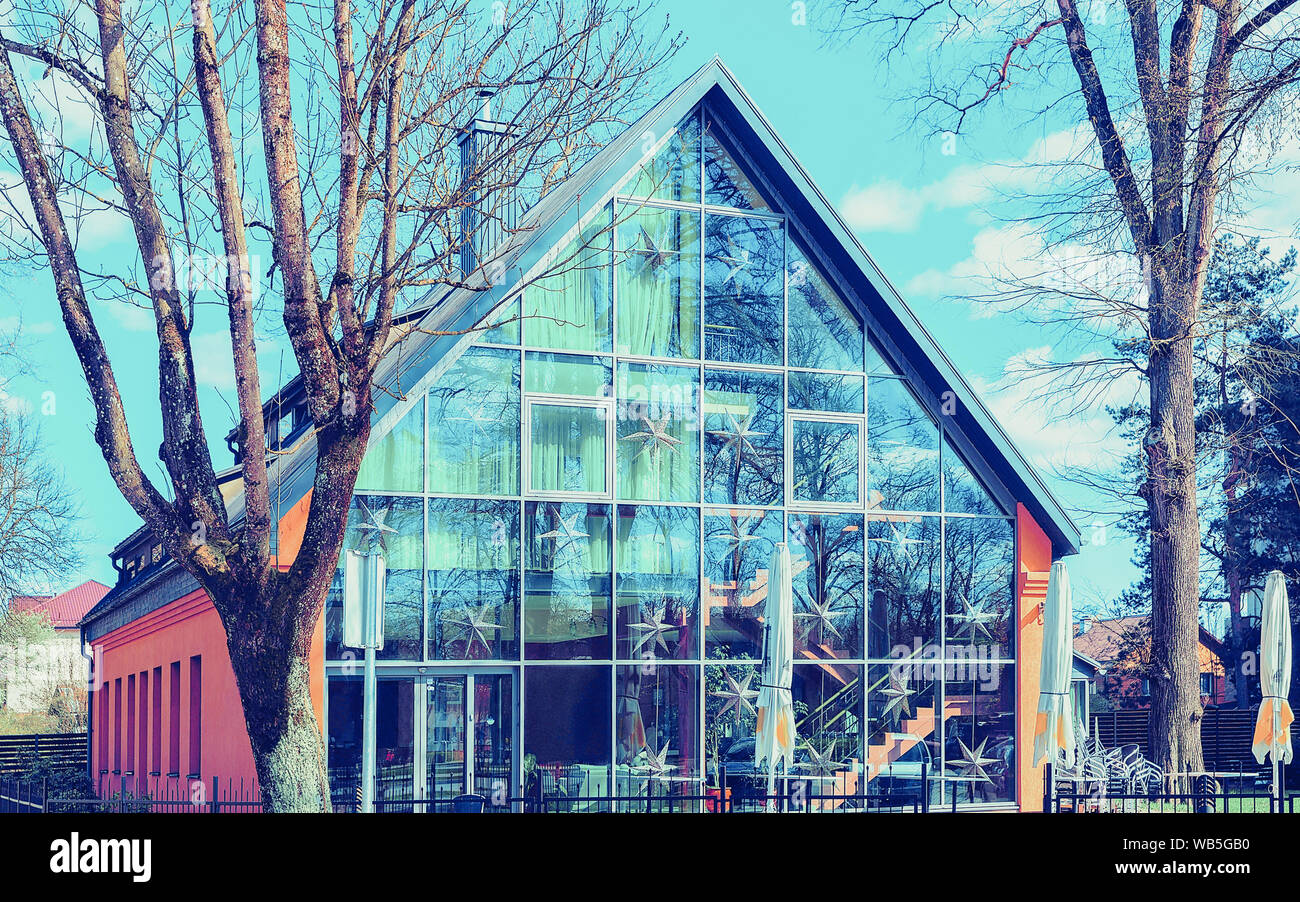 EU Modern glass cottage house, small courtyard. Toned Stock Photo - Alamy