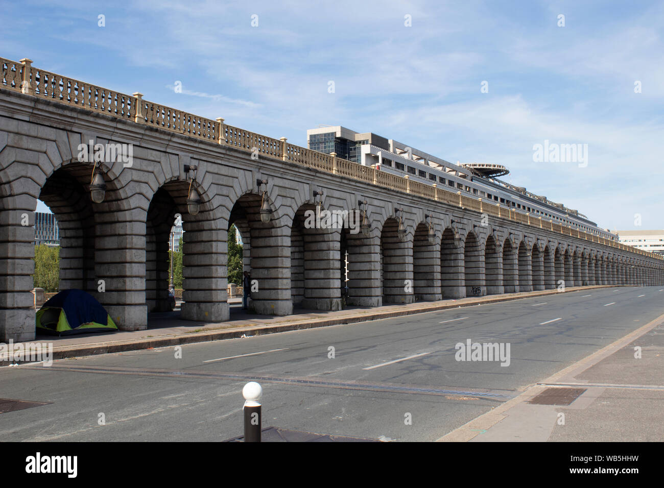 Arched bridge supporting rail tracks going over the River Seine Pont De ...