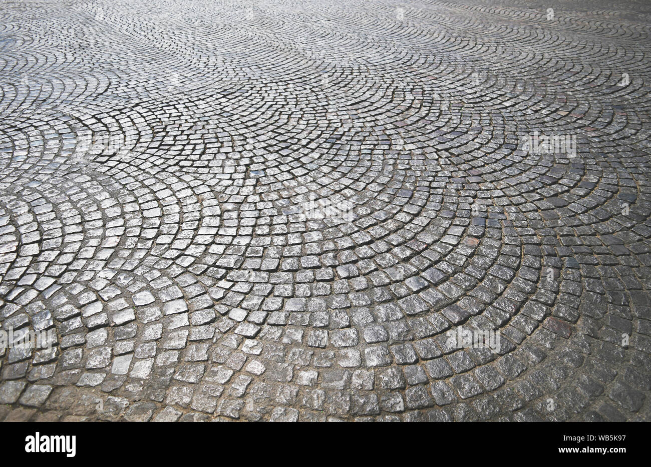 Gray stone road surface shiny, cobbled road, cobble surface Stock Photo ...