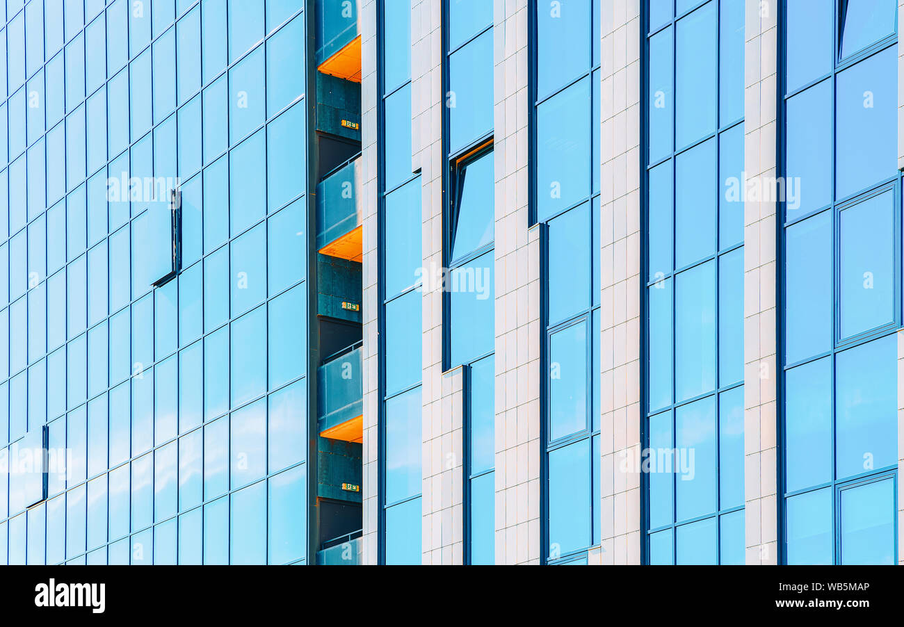 EU Glass windows reflecting the blue sky as details of modern ...