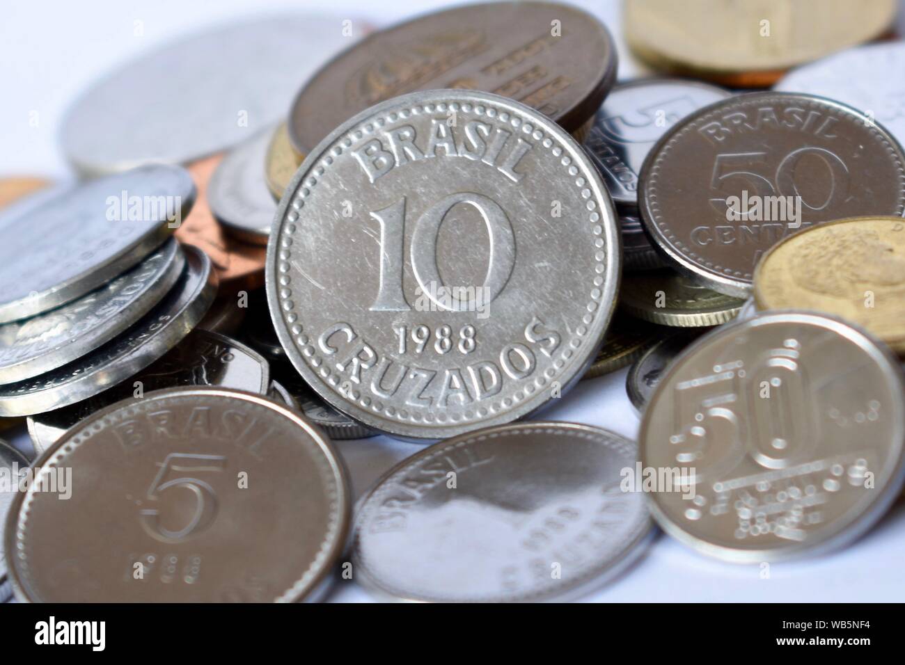 Brazilian currency 10 cruzados coin on top of coins from other ...