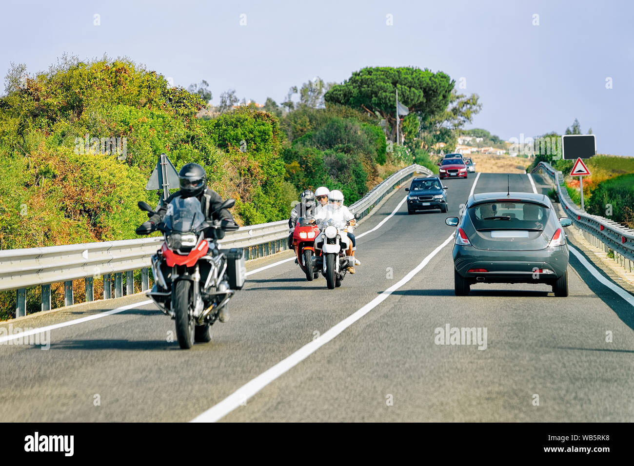 Motorcycle and car on winding road hi-res stock photography and images ...