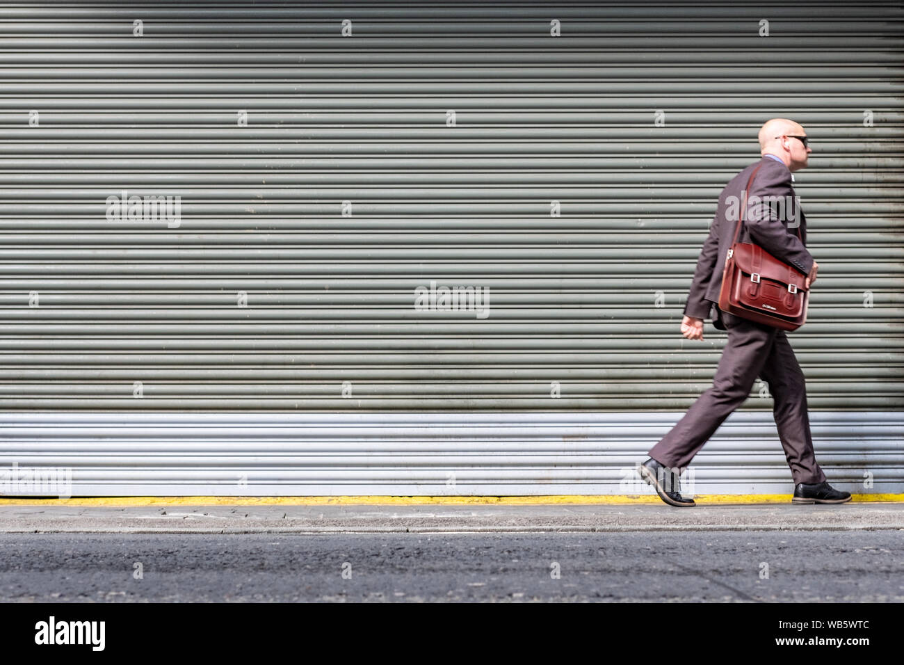 Business man walking street hi-res stock photography and images - Alamy