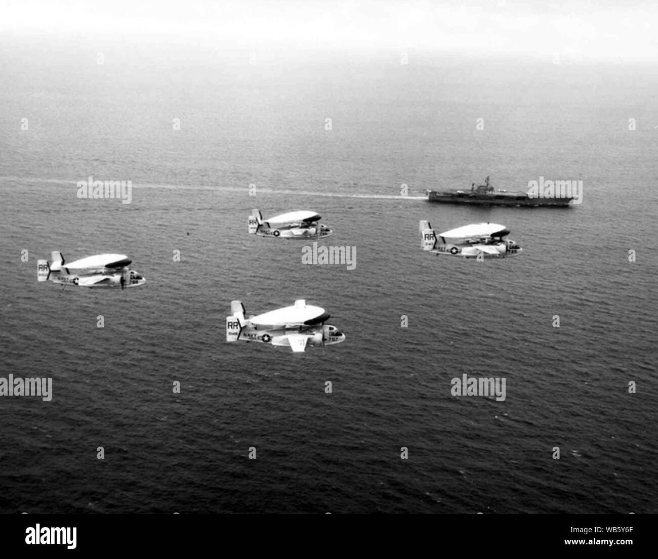 E-1B Tracers of VAW-11 fly past USS Constellation (CVA-64) in 1963-64 ...