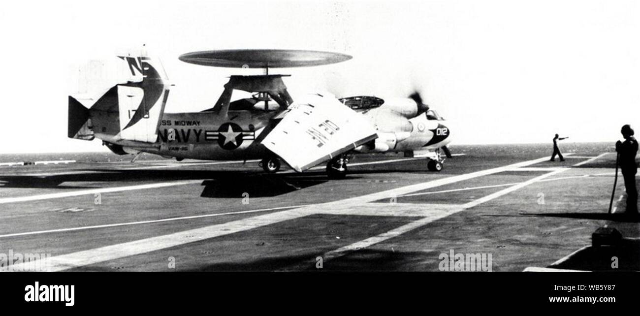 E-2B Hawkeye of VAW-115 folding wings on USS Midway (CVA-41) in 1971 ...