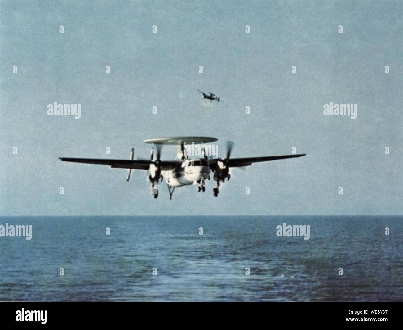 E-2B Hawkeyes of VAW-114 approach USS Kitty Hawk (CV-63) c1974 Stock ...