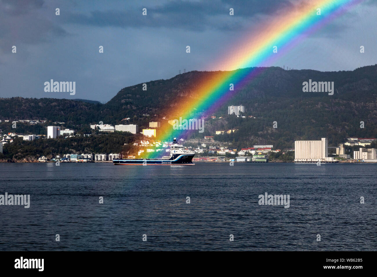 A rainbow shining over PSV platform supply vessel North Pomor, awaiting ...