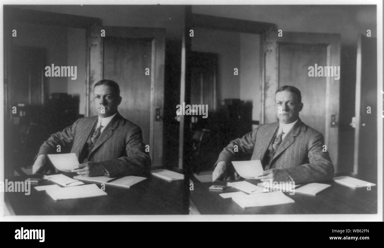 Earl Rogers, half-length portrait, seated at desk Stock Photo - Alamy
