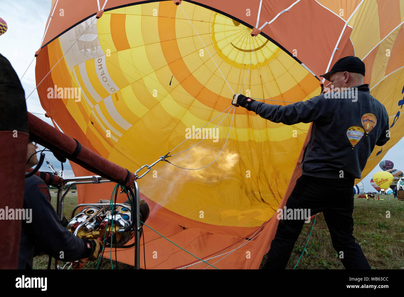 Chambley, France. 2nd August, 2019. Inflating a hot air balloon before ...