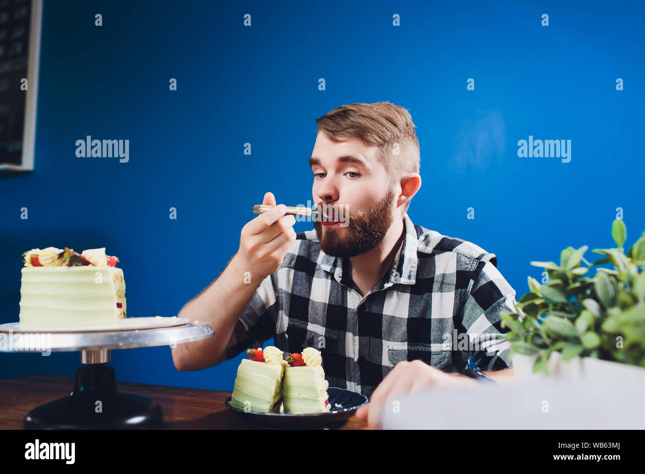 Handsome man eating pie hi-res stock photography and images - Alamy