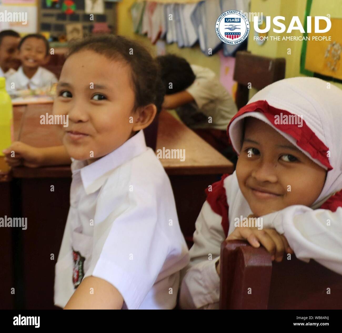 Early graders in USAID partner schools read illustrated books to help ...
