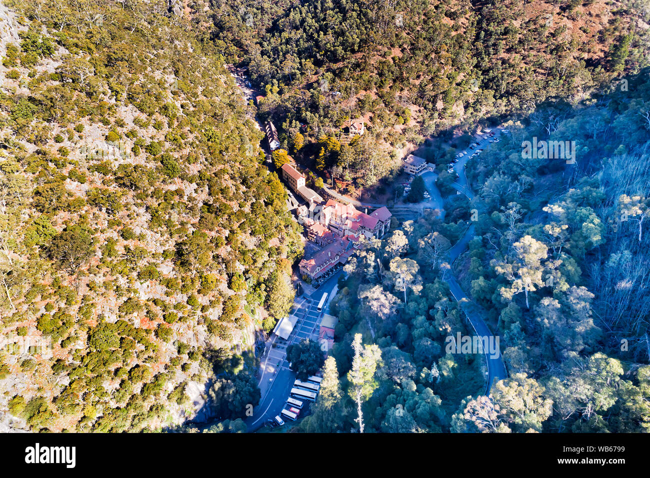 Jenolan town down in a narrow creek between steep tall mountain ranges ...